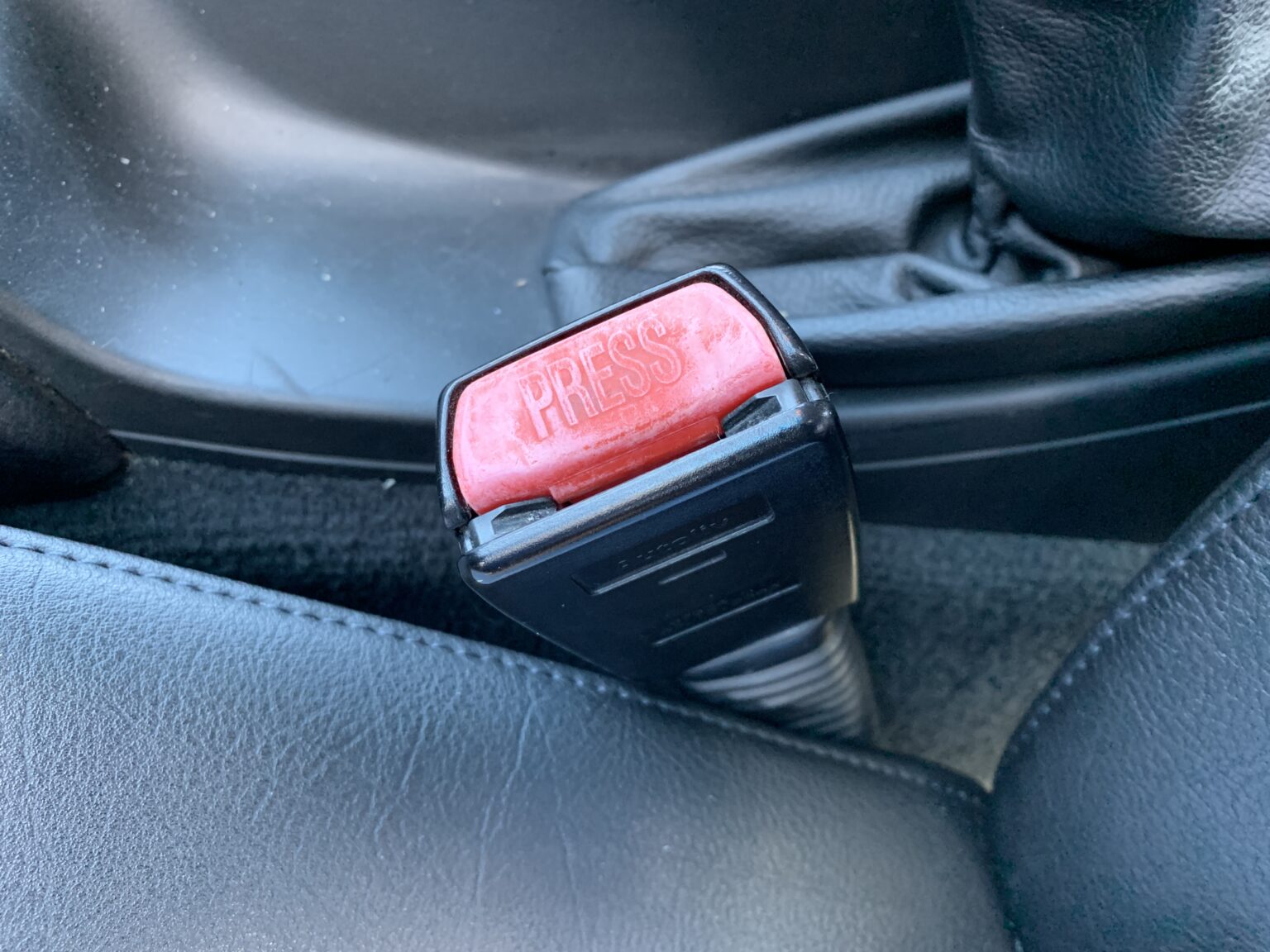 How to Restore Faded Red Seatbelt Buttons - The Track Ahead